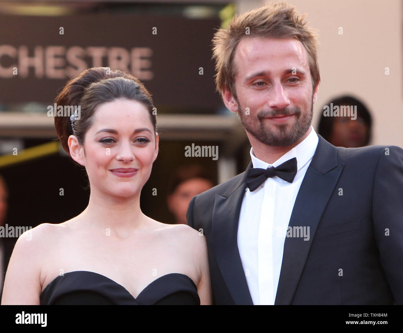 Marion Cotillard (L) and Mathias Schoenaerts arrive on the red-carpeted ...