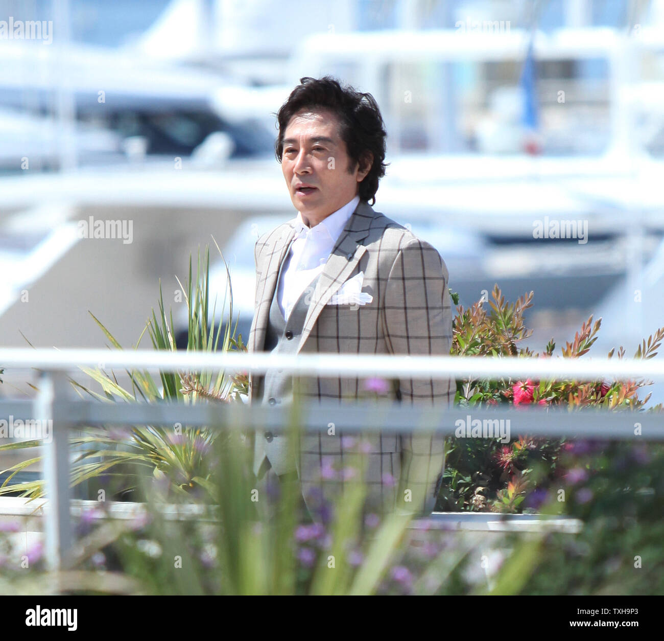 Baek Yoon-Sik arrives at a photocall for the film "Do-Nui Mat (The ...