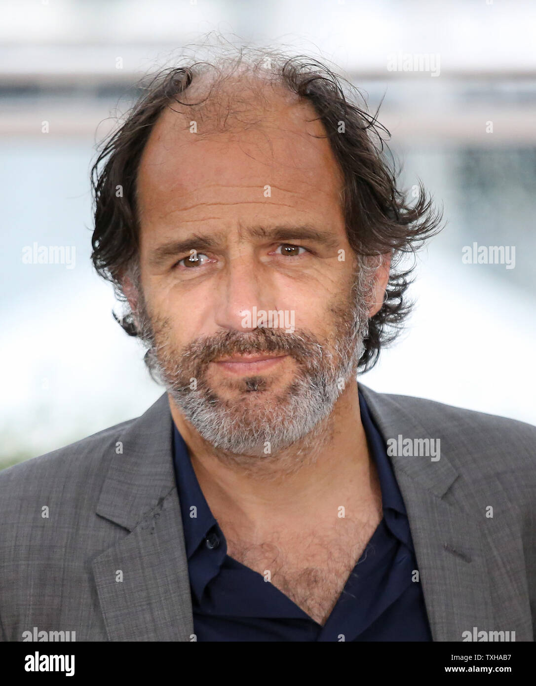 Frederic Pierrot arrives at a photocall for the film "Jeune & Jolie ...