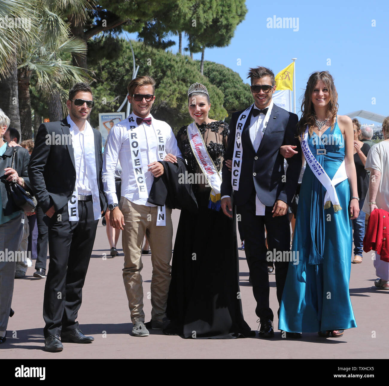 Contestants for the Miss Europe contest and their dates walk along the ...