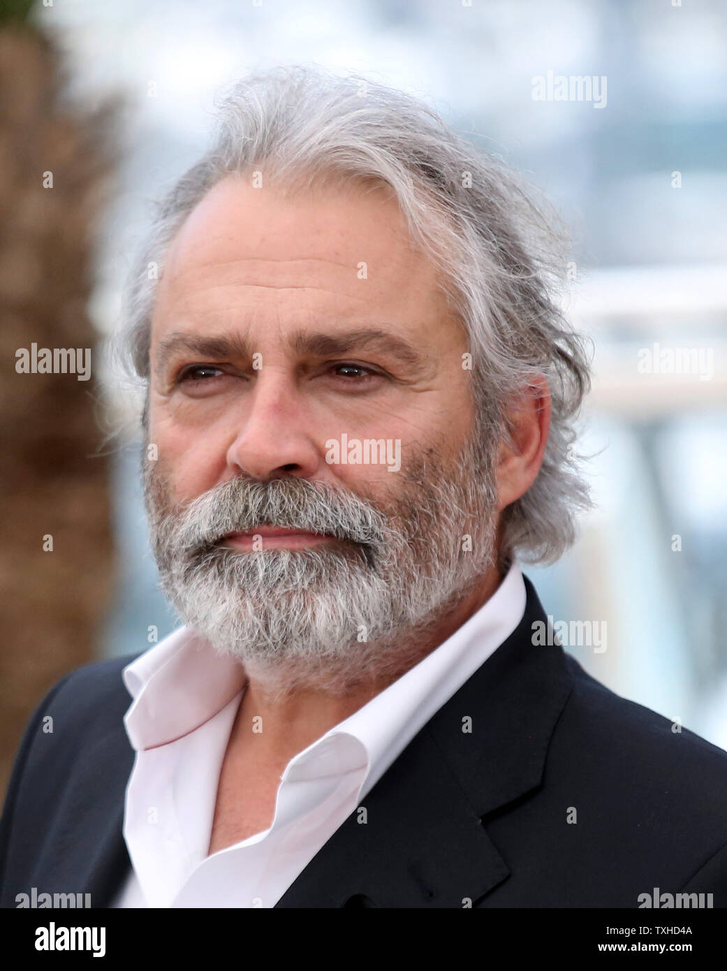 Haluk Bilginer arrives at a photo call for the film "Winter Sleep ...