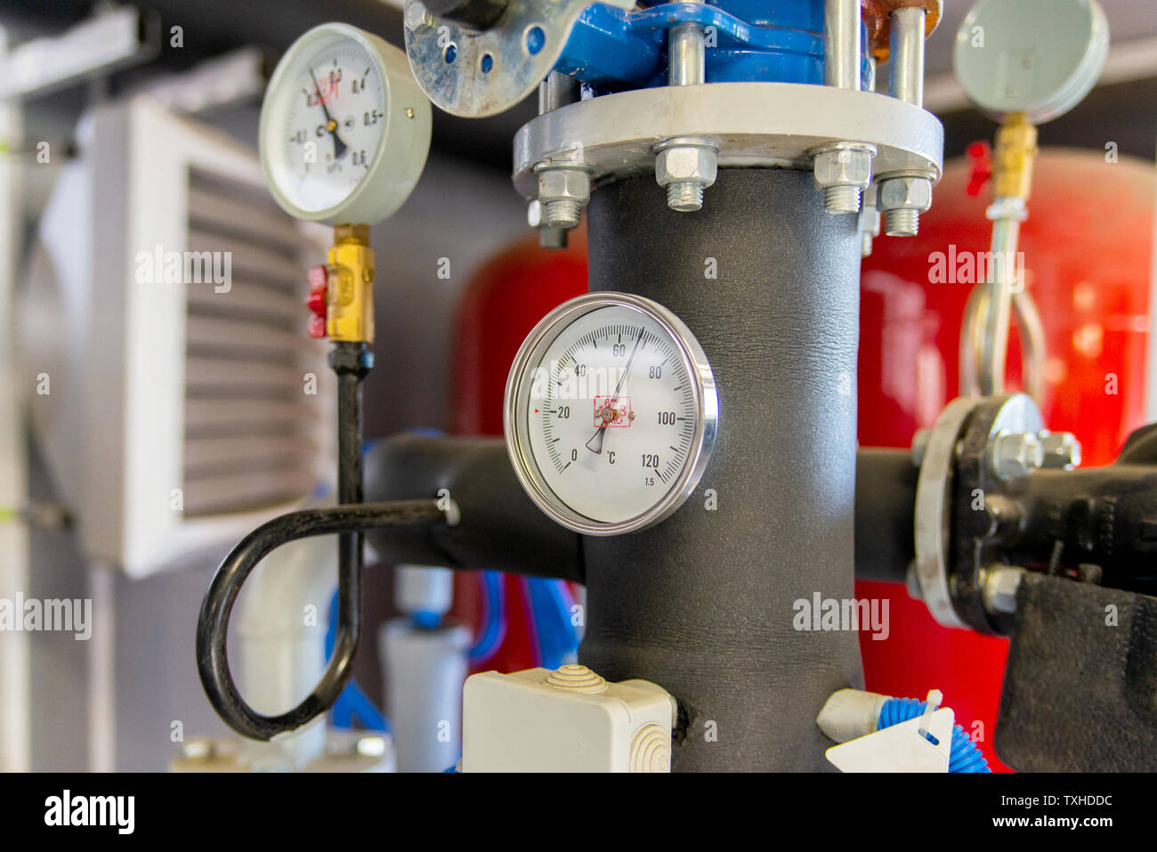 The equipment of the boiler-house, valves, tubes, pressure gauges ...
