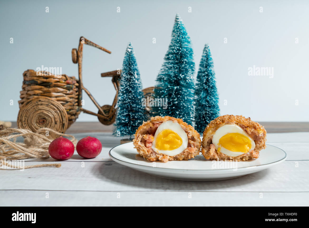 Scottish egg pendulum plate with white background Stock Photo - Alamy