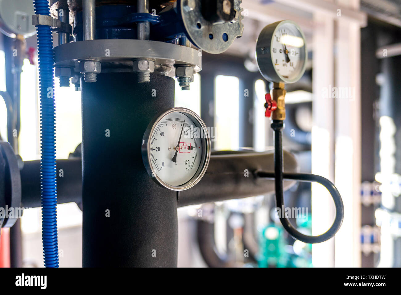 The equipment of the boiler-house, valves, tubes, pressure gauges ...