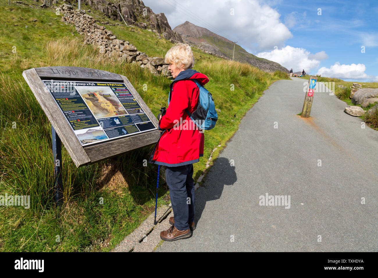 A walker studies the bi-lingual information board about the Miners and ...