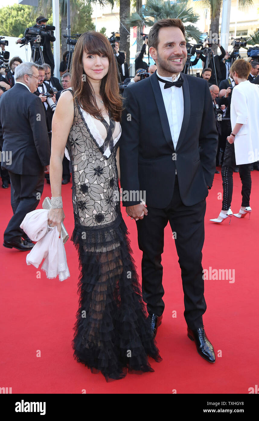 Delphine McCarty (L) and Christophe Michalak arrive on the red carpet ...