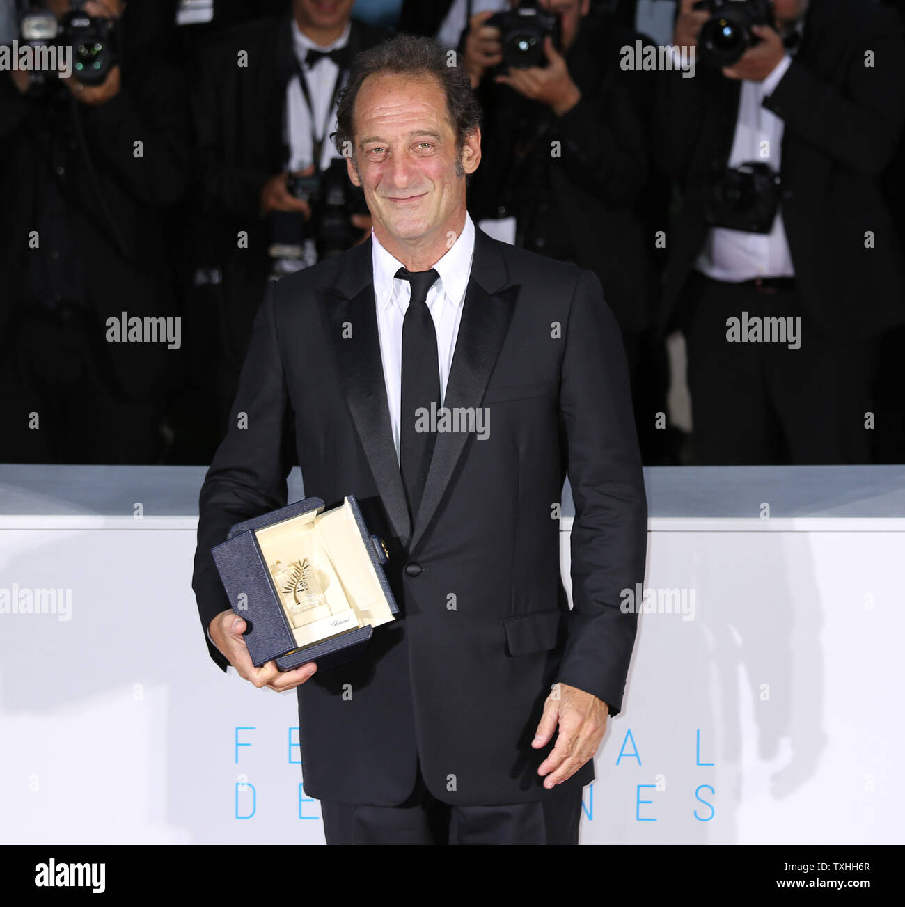 Vincent Lindon arrives at the award photo call after receiving the ...