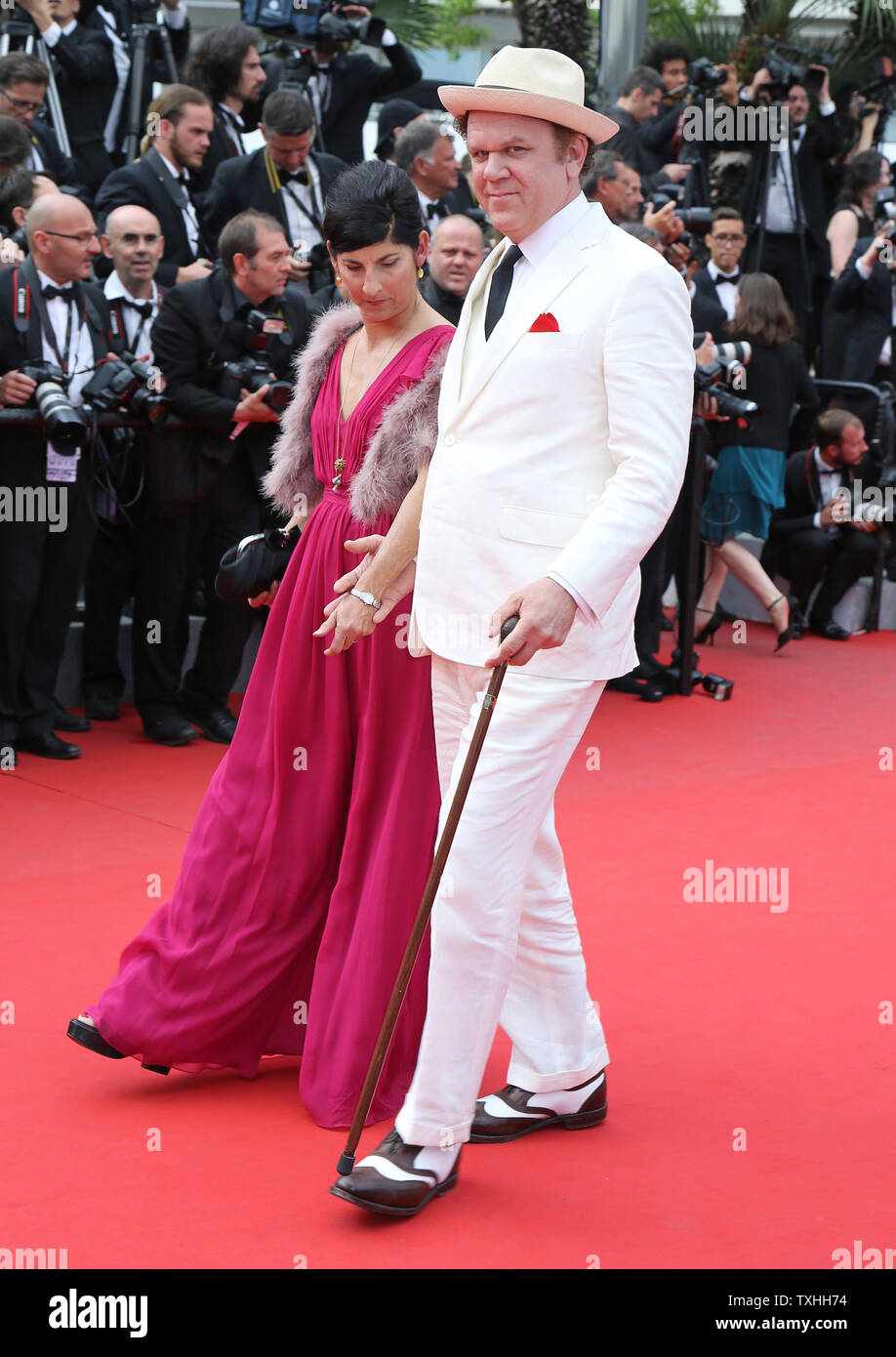 John C. Reilly (R) and Alison Dickey arrive on the red carpet before ...