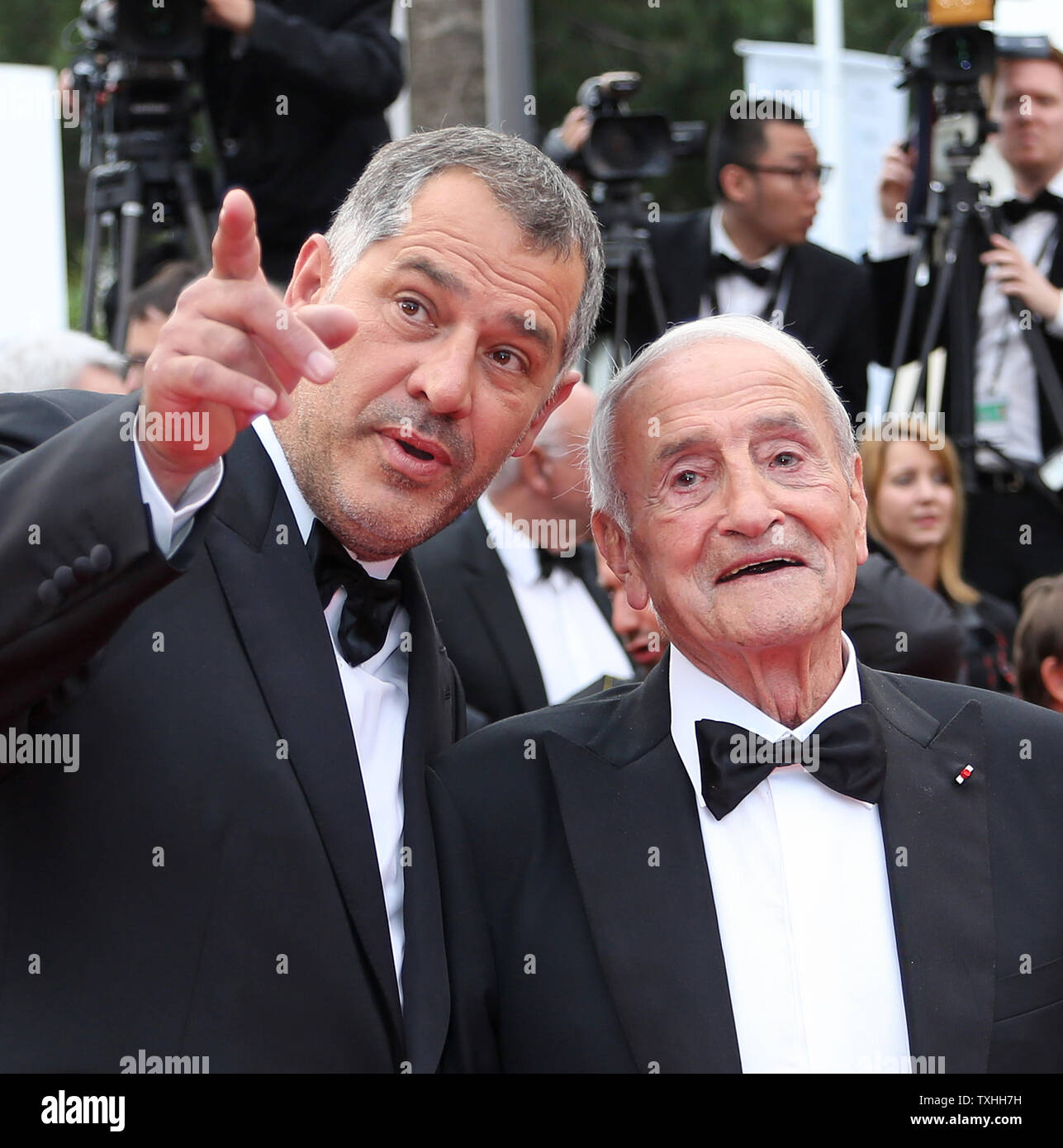 Luc Jacquet (L) and Claude Lorius arrive on the red carpet before the ...