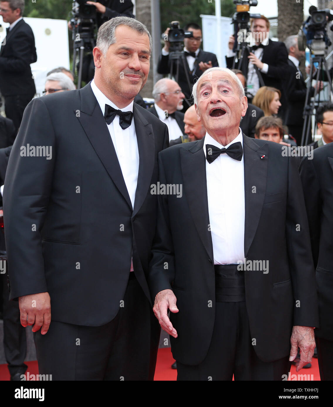 Luc Jacquet (L) and Claude Lorius arrive on the red carpet before the ...