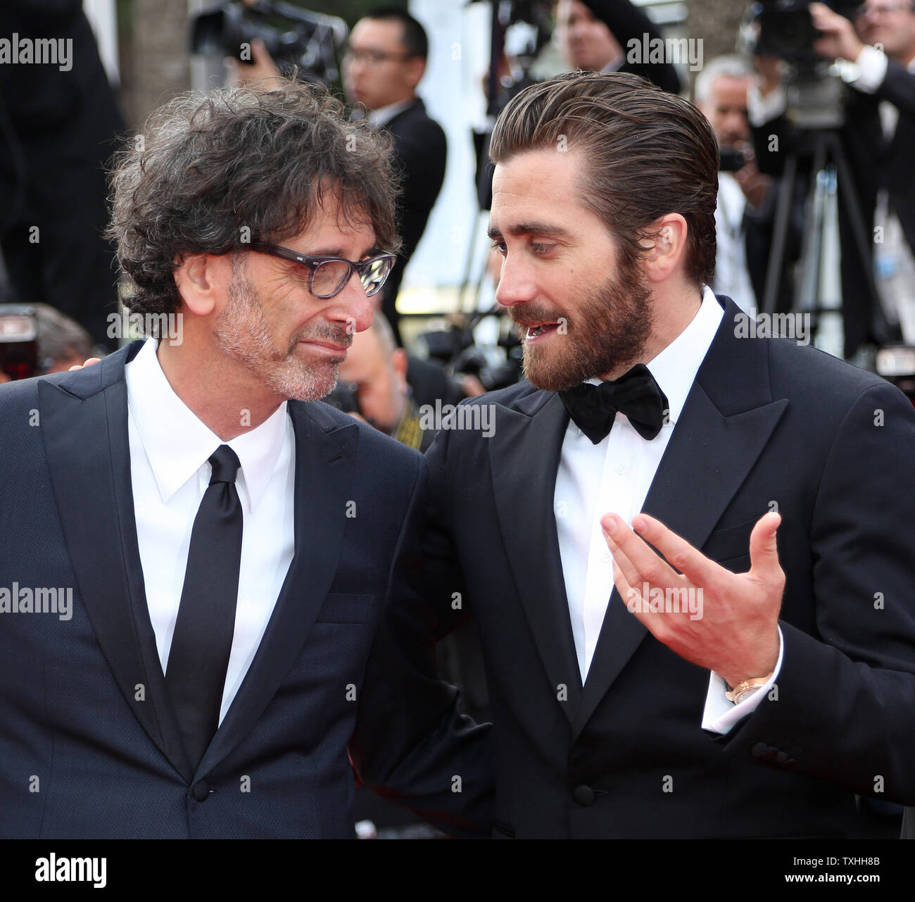 Joel Coen (L) and Jake Gyllenhaal arrive on the red carpet before the ...