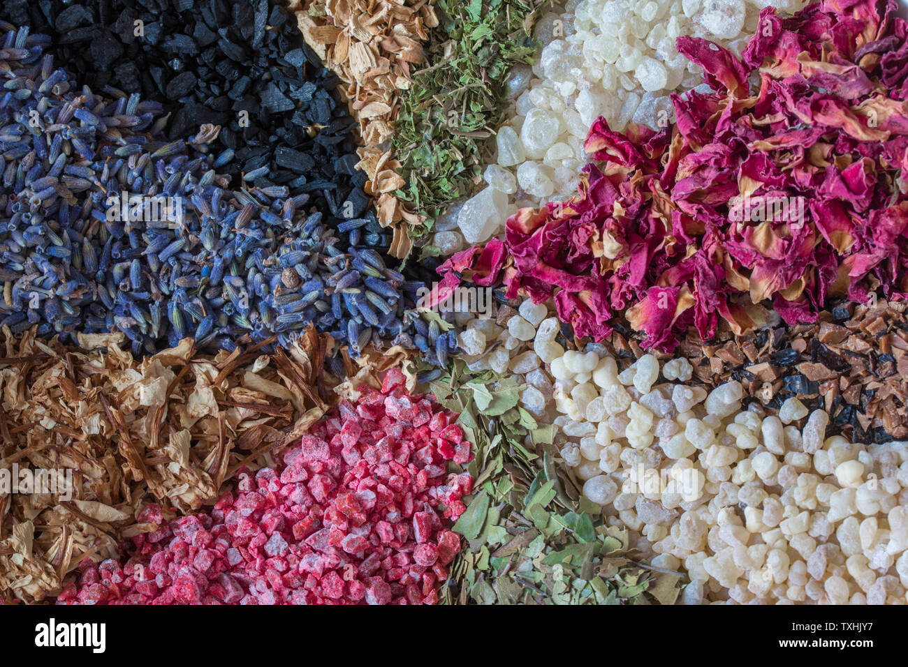 Close up picture of dried incense in a ceramic bowl, wooden background ...