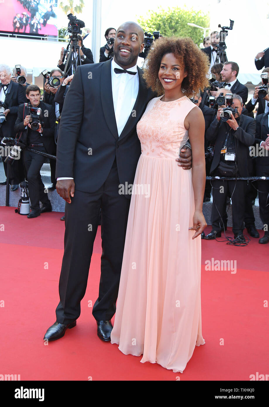 Teddy Riner (L) and Luthna Lors arrive on the red carpet before the ...