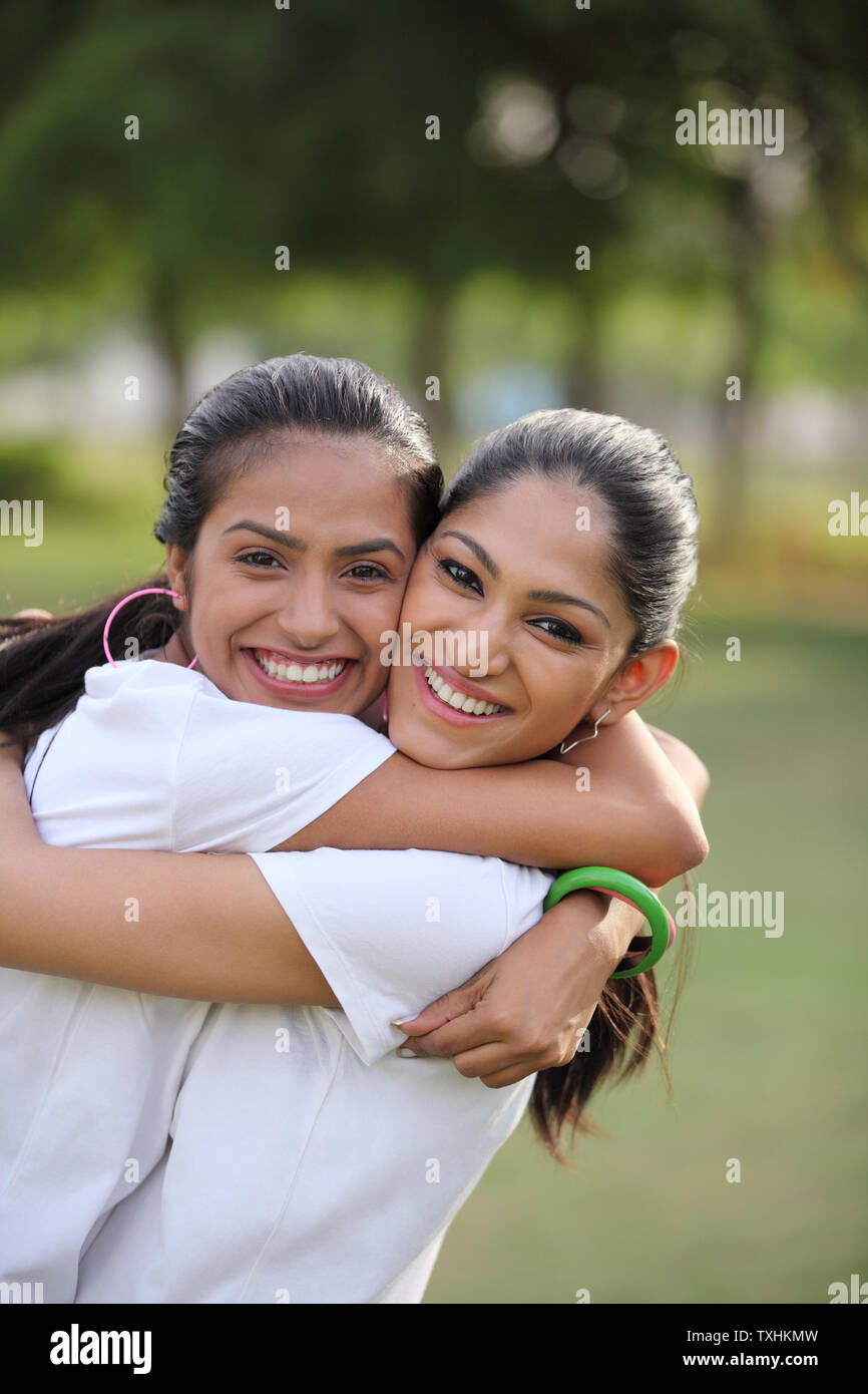 Two friends hugging each other and smiling Stock Photo - Alamy Two friends hugging each other and smiling Stock Photo - Alamy