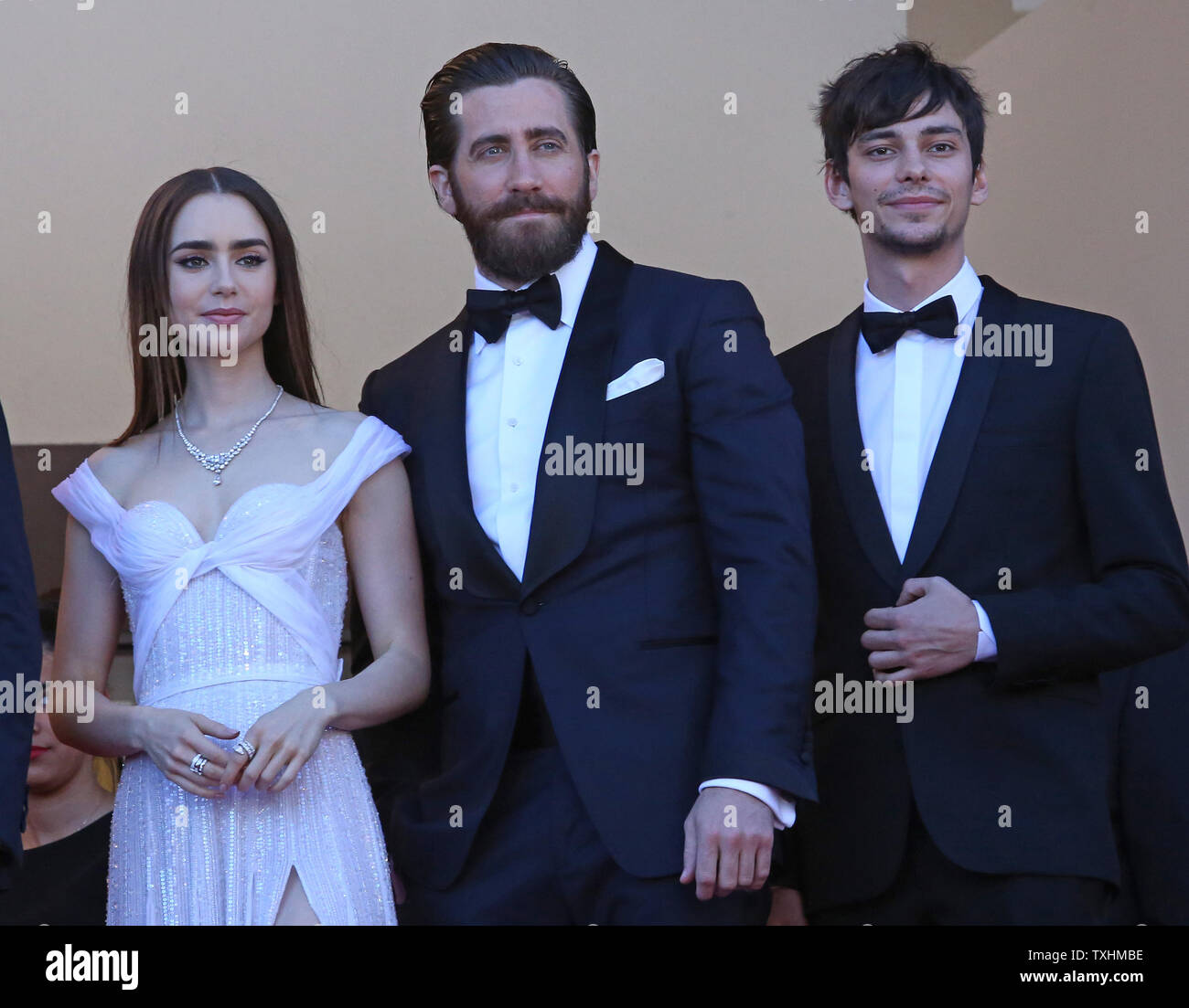 Lily Collins (L), Jake Gyllenhaal (C) and Devon Bostic arrive on the ...