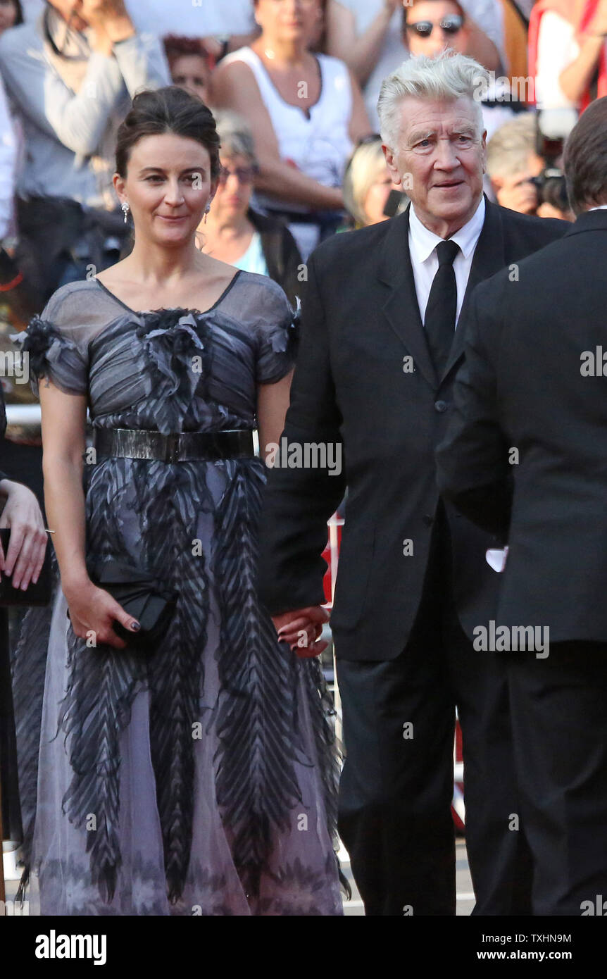 Emily Stofle (L) and David Lynch arrive on the red carpet before the ...