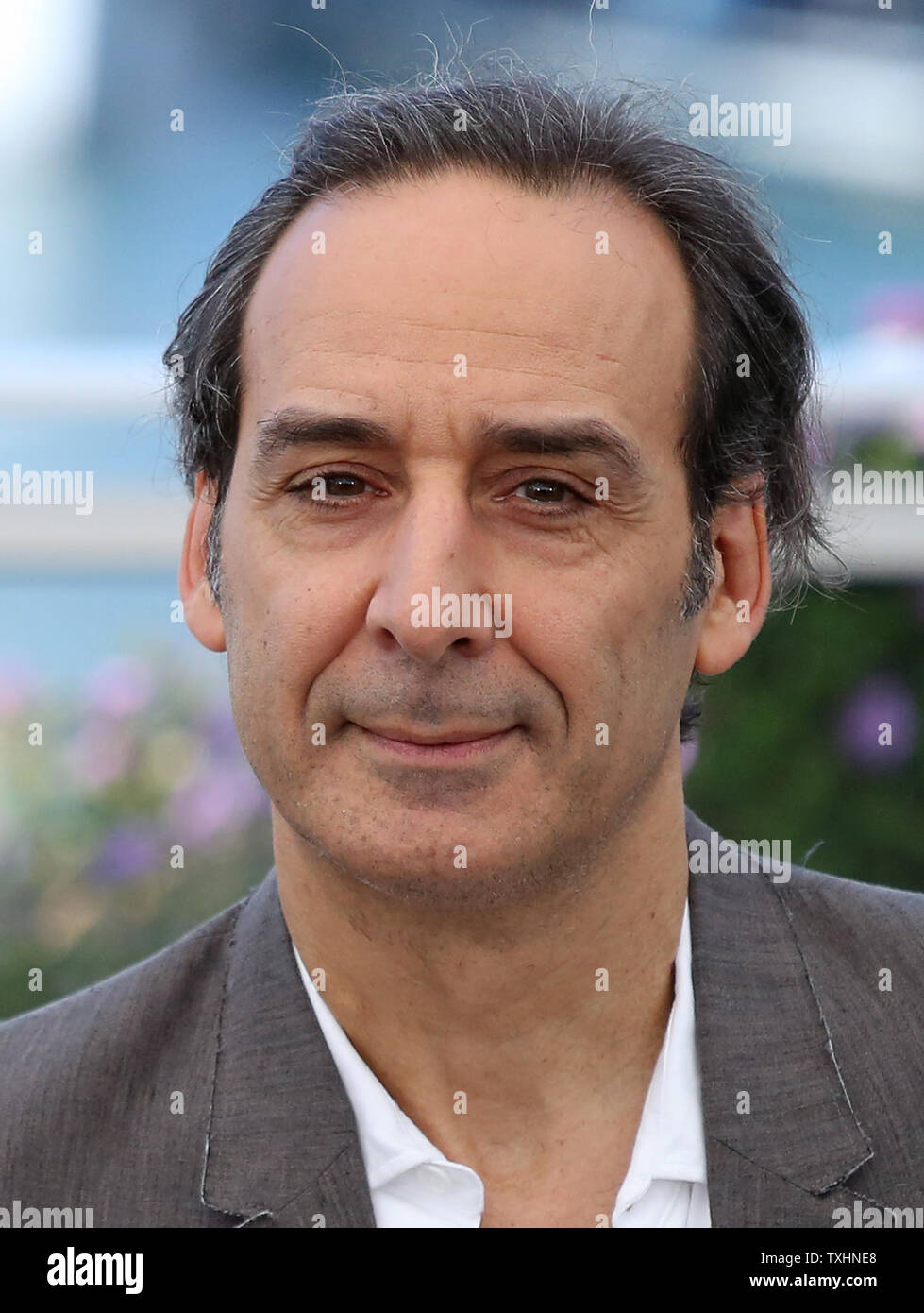 Alexandre Desplat arrives at a photocall for the film "D'Apres une ...