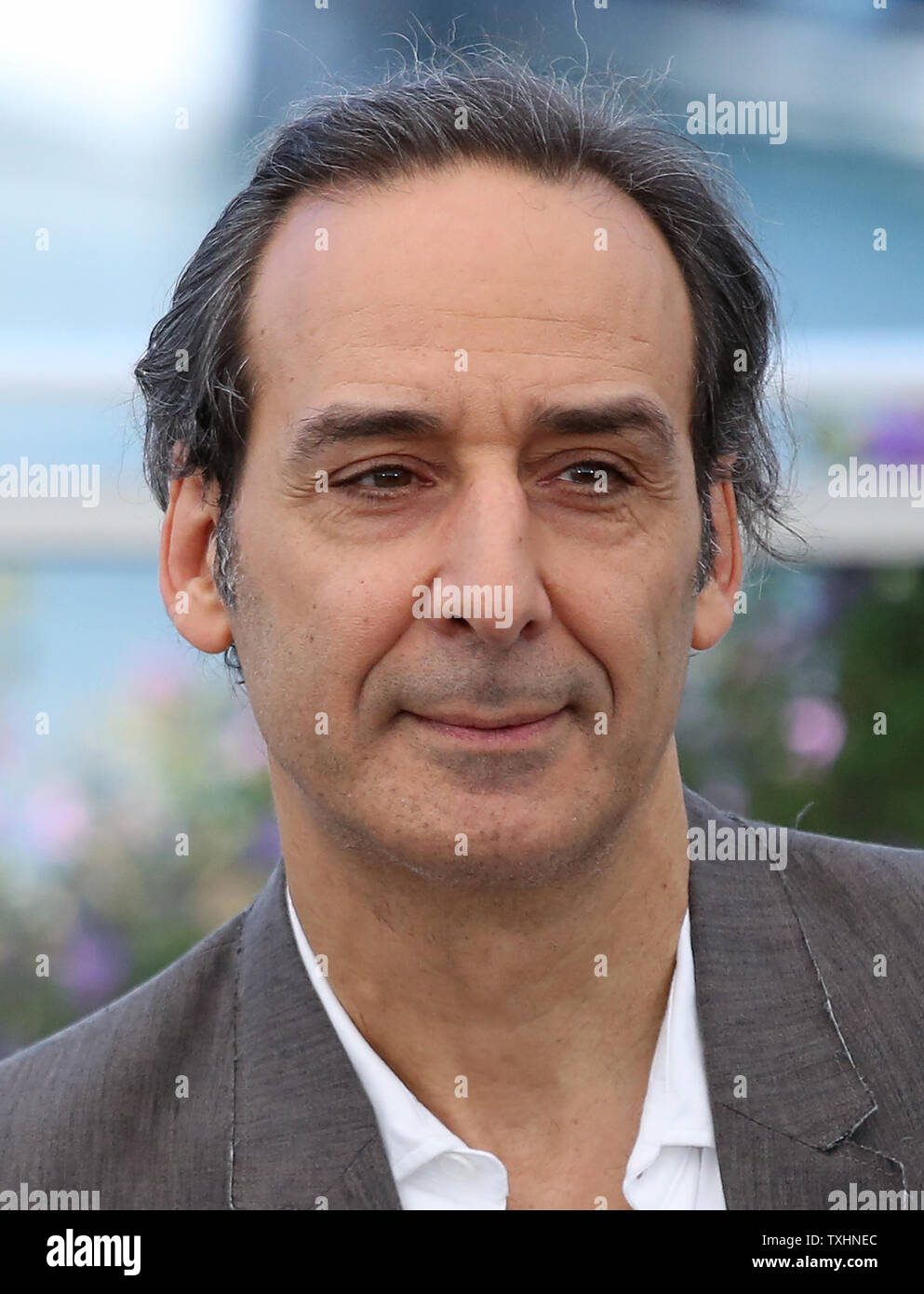 Alexandre Desplat arrives at a photocall for the film "D'Apres une ...