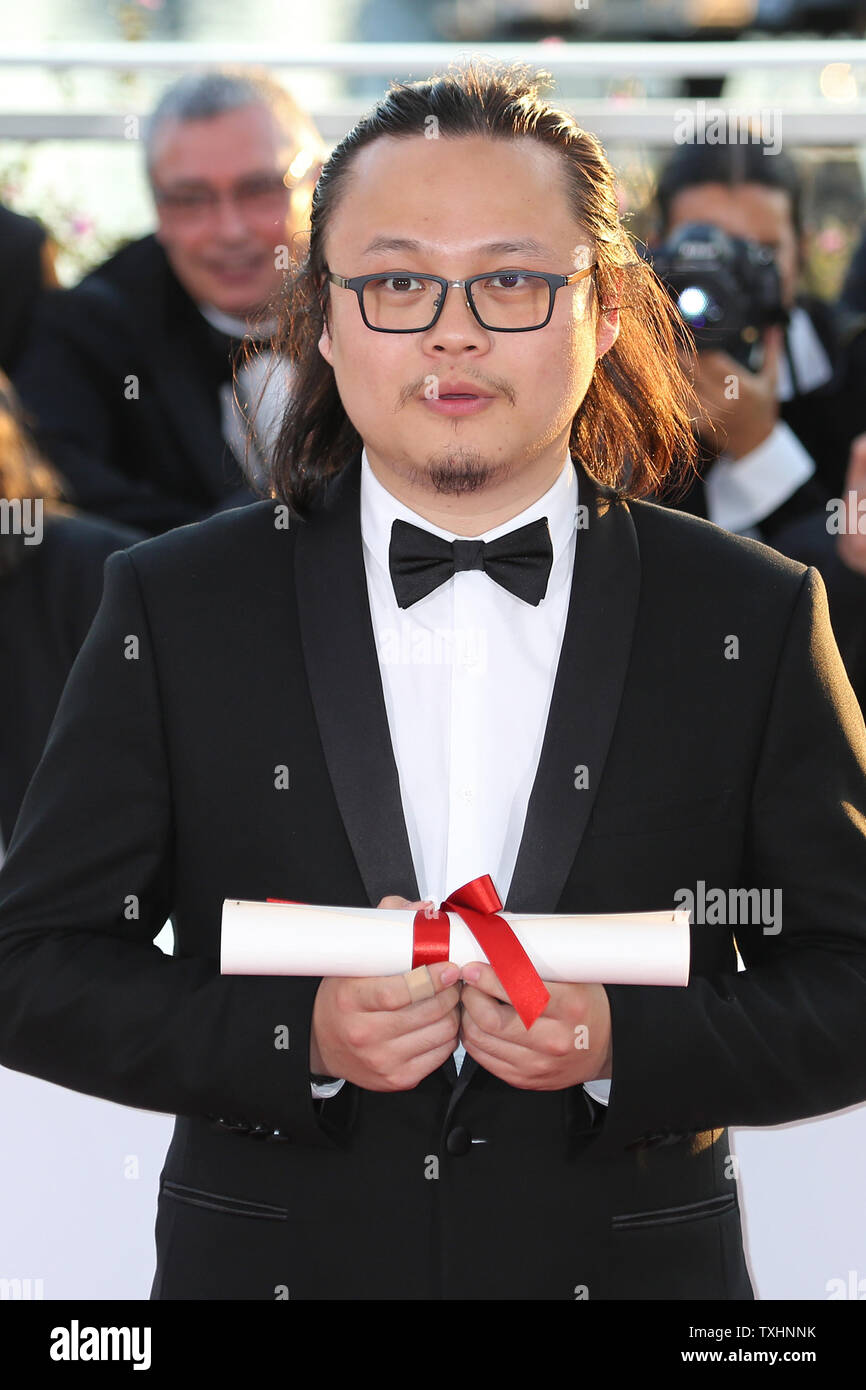 Qiu Yang arrives at the award photocall after receiving the "Best Short ...