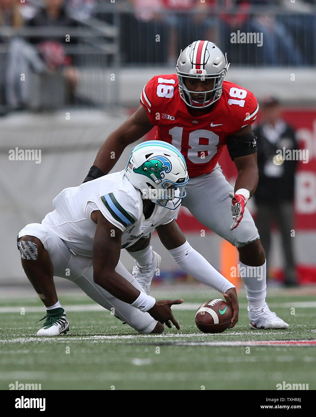 Tulane quarterback Donnie Lewis Jr. recovers his own fumble as Ohio ...