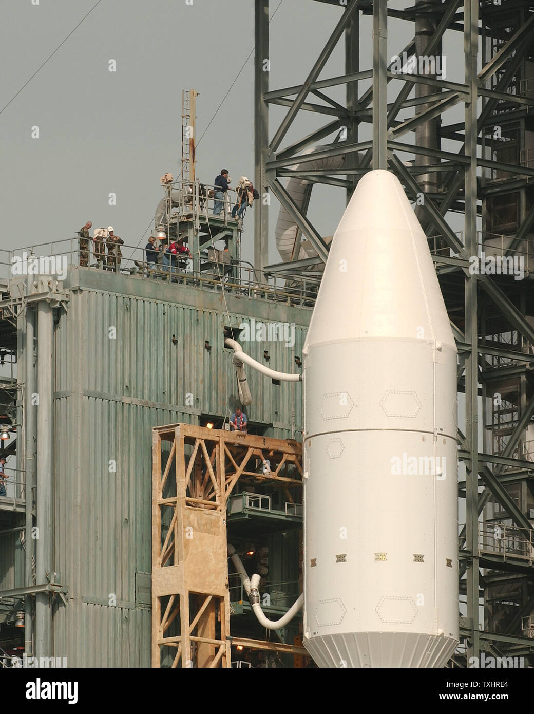 Lockheed Martin engineers stand atop the Titan IOB at Launch Complex 40 ...