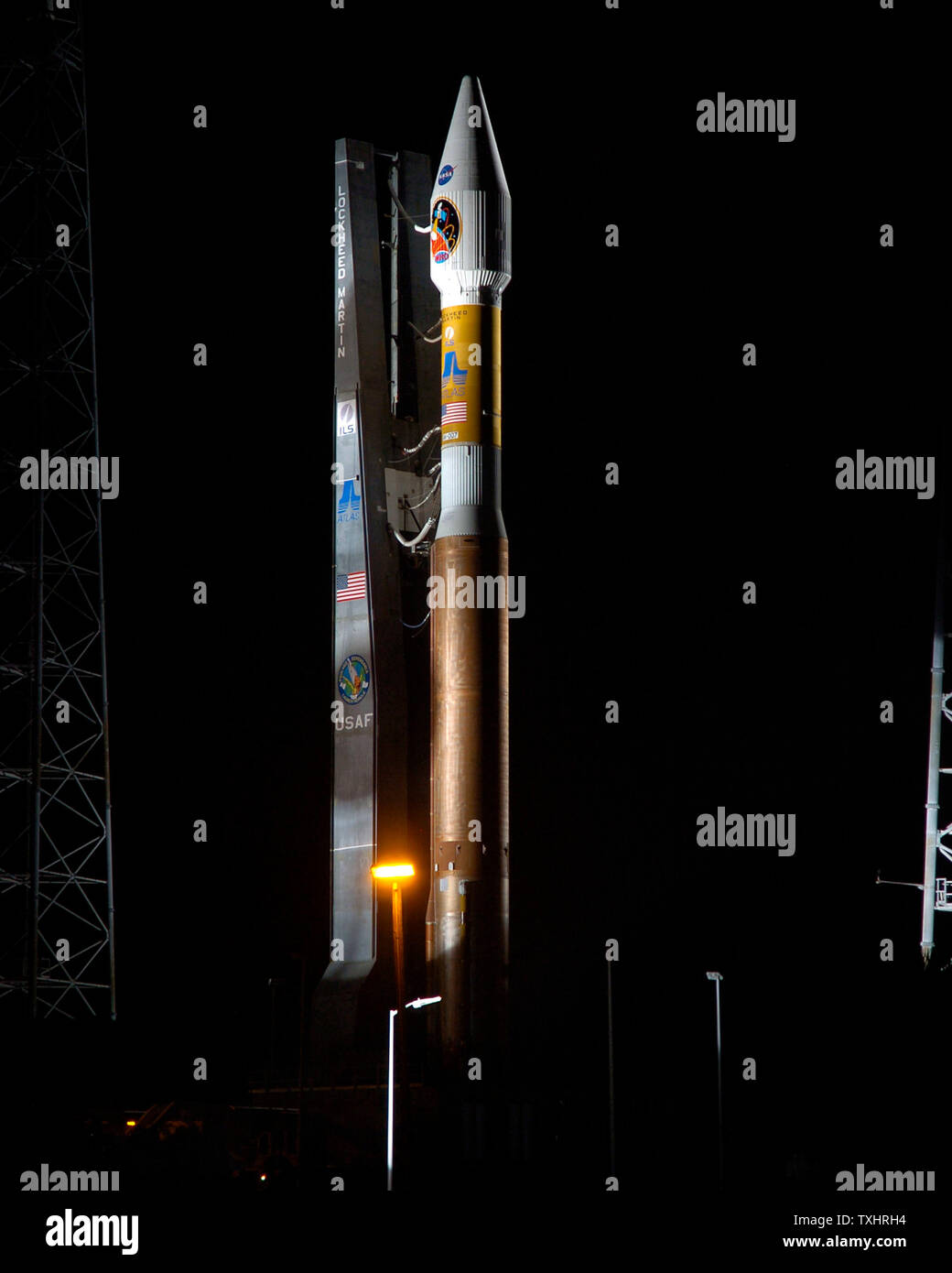 An Atlas V rocket rolls to Launch Complex 41 in preparation for ...
