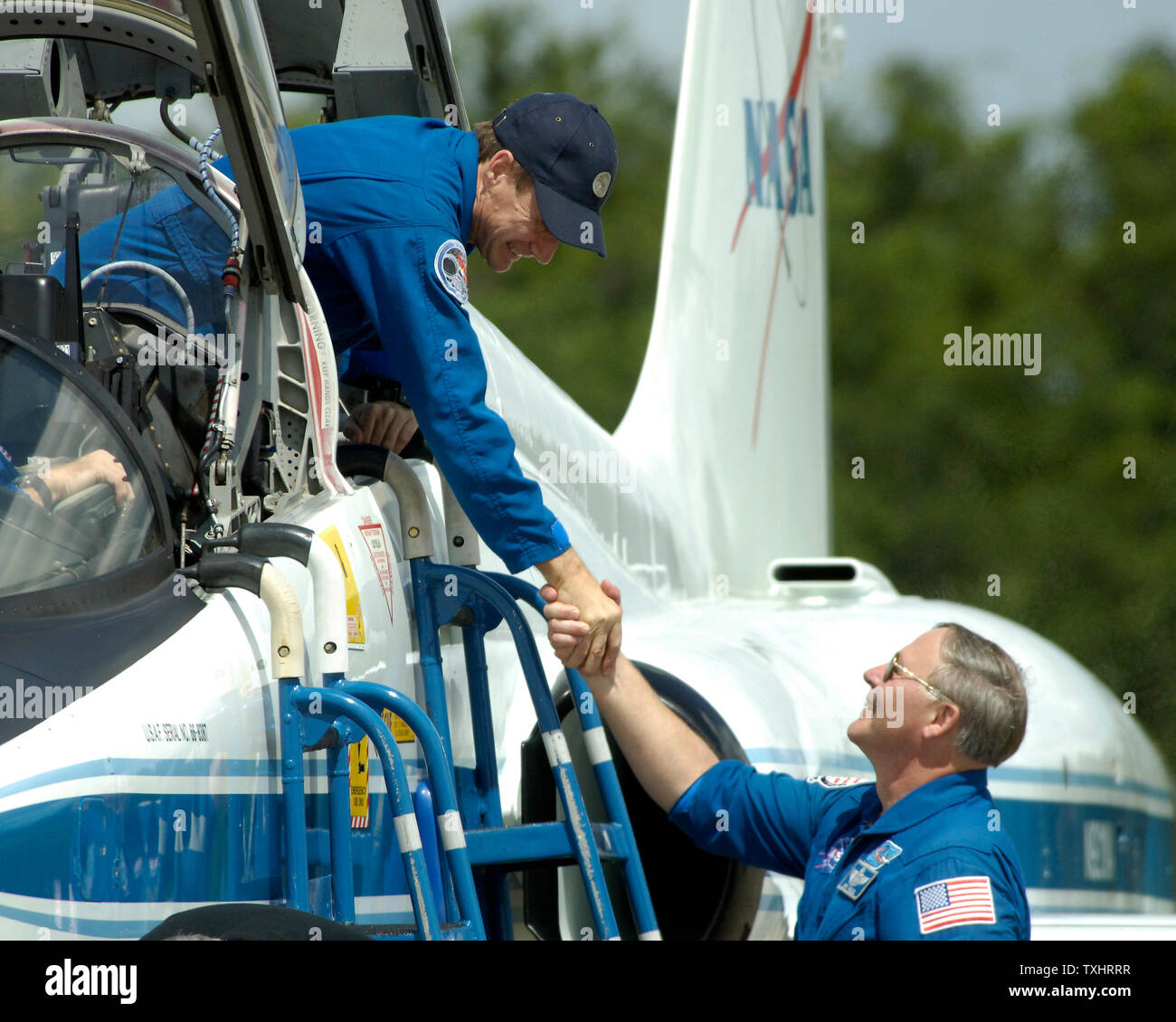 NASA Astronaut Jerry Ross (R) welcomes Canadian Space Agency Astronaut ...