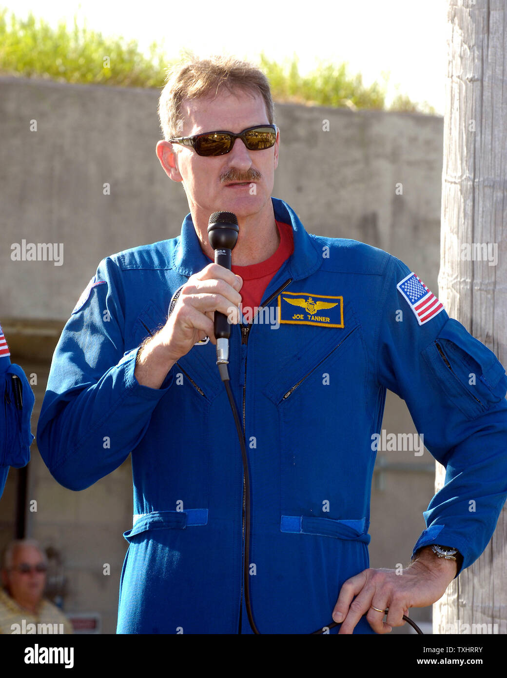 Astronaut Joe Tanner, a member of the crew of STS 115, responds to ...