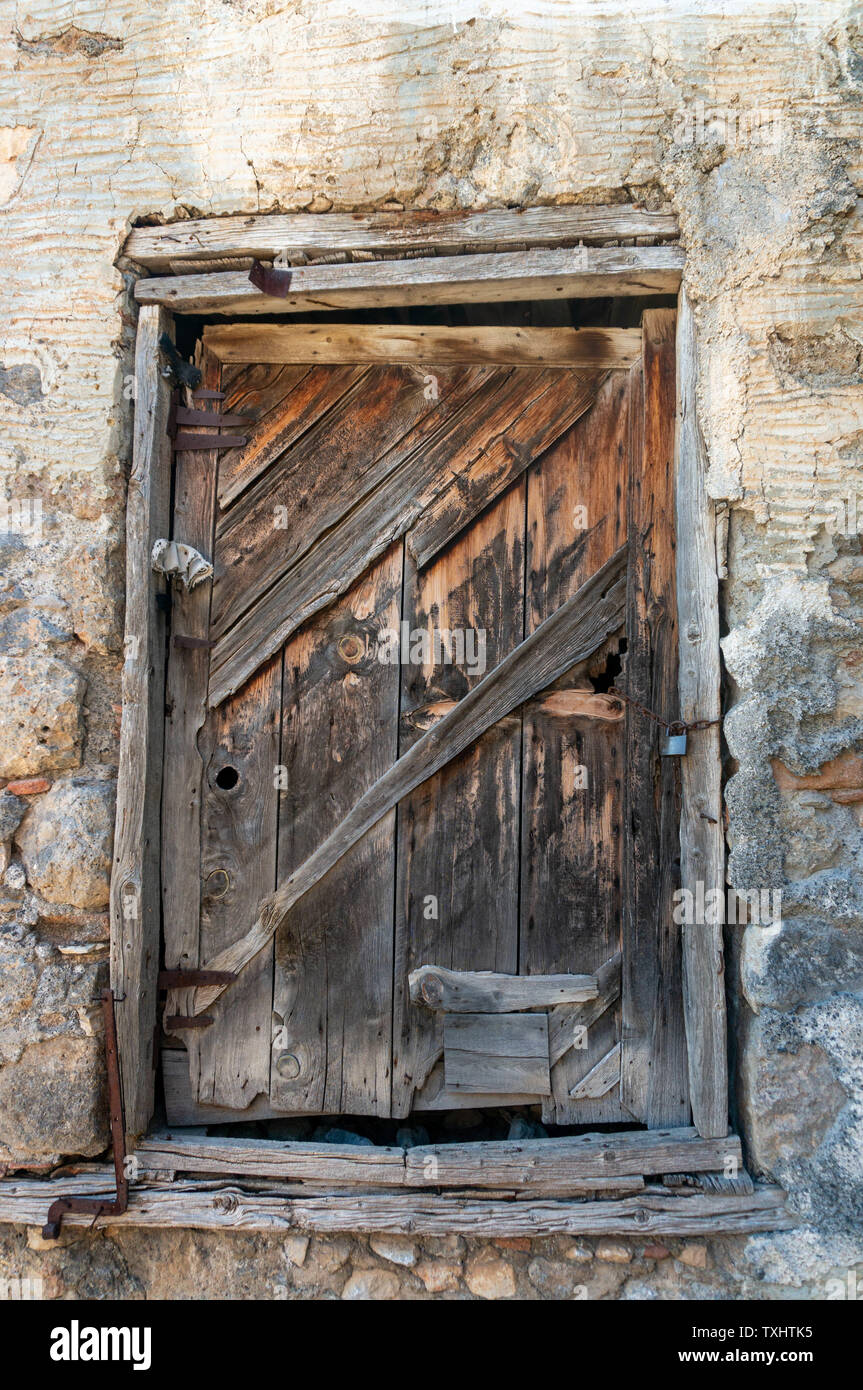 An old wooden door set in a brick building Stock Photo - Alamy
