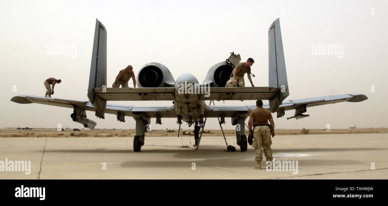 AFIE2003041701 - IRAQ, April 8 (UPI) -- A-10 maintenance members from ...