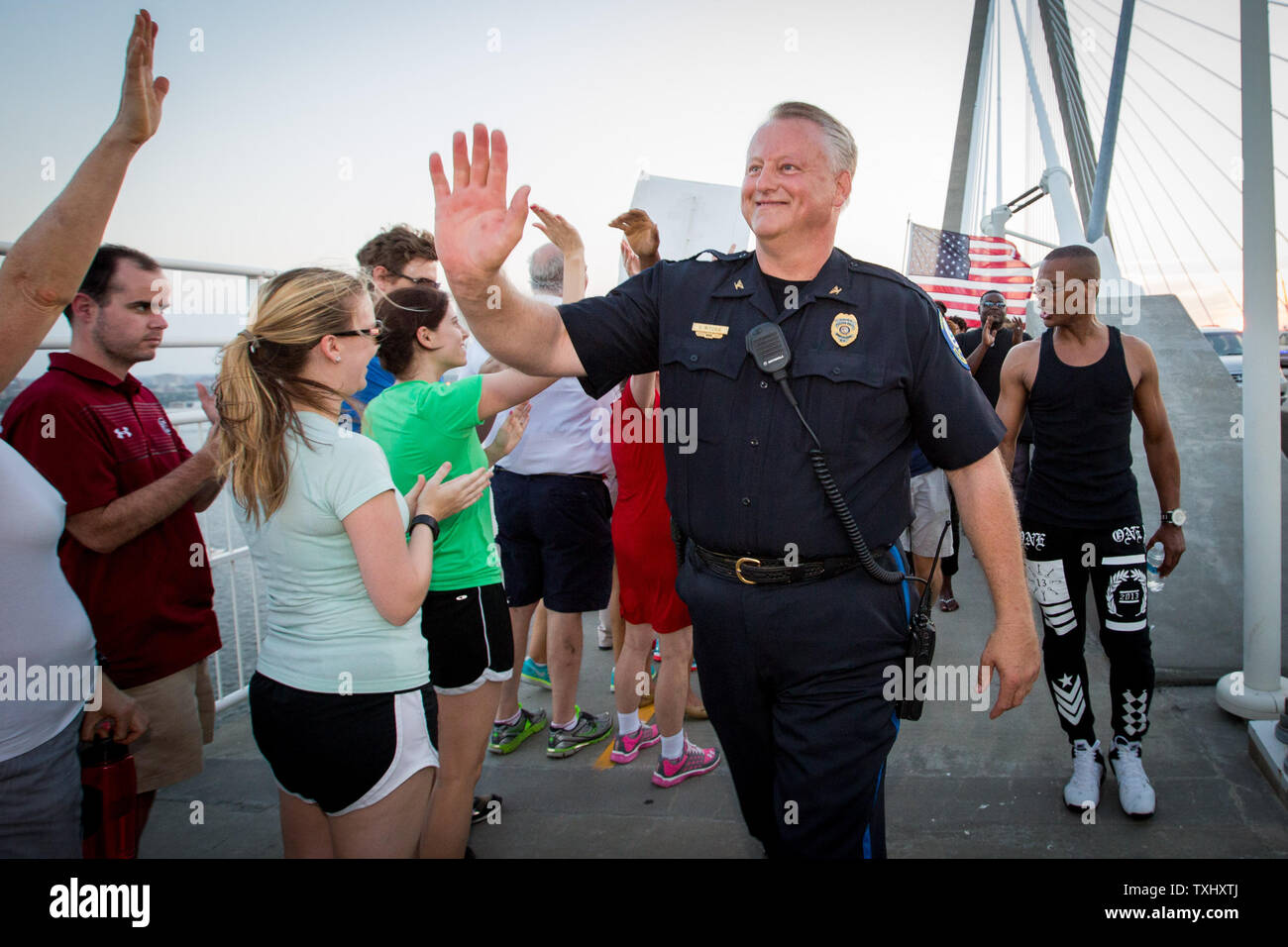 Mt. Pleasant Police Chief Carl Ritchie is greeted along the Arthur ...