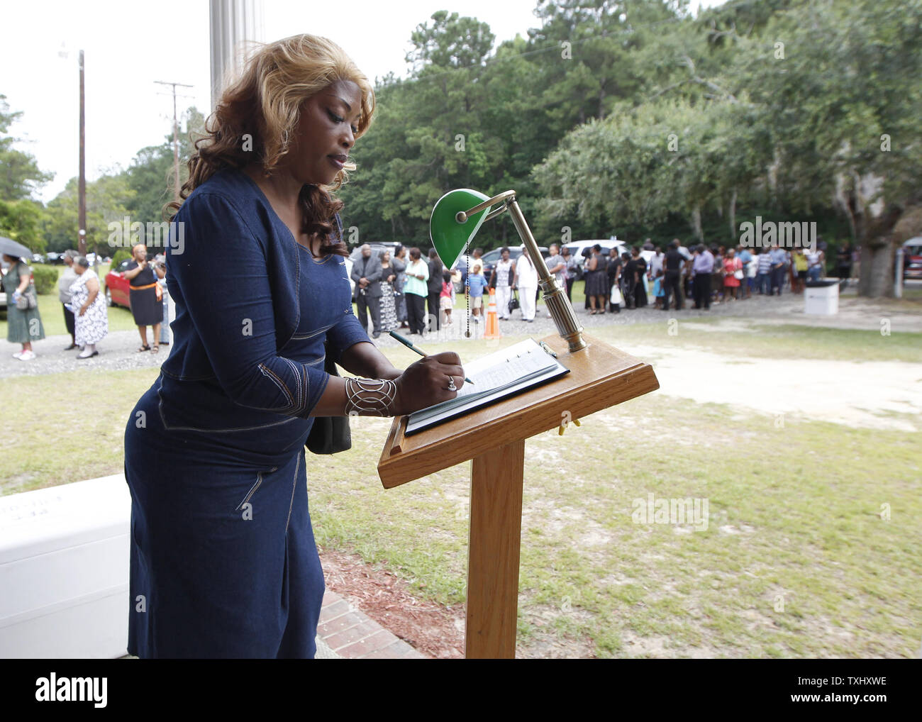 Tonya Brooks signs a guestbook at a viewing for South Carolina State ...