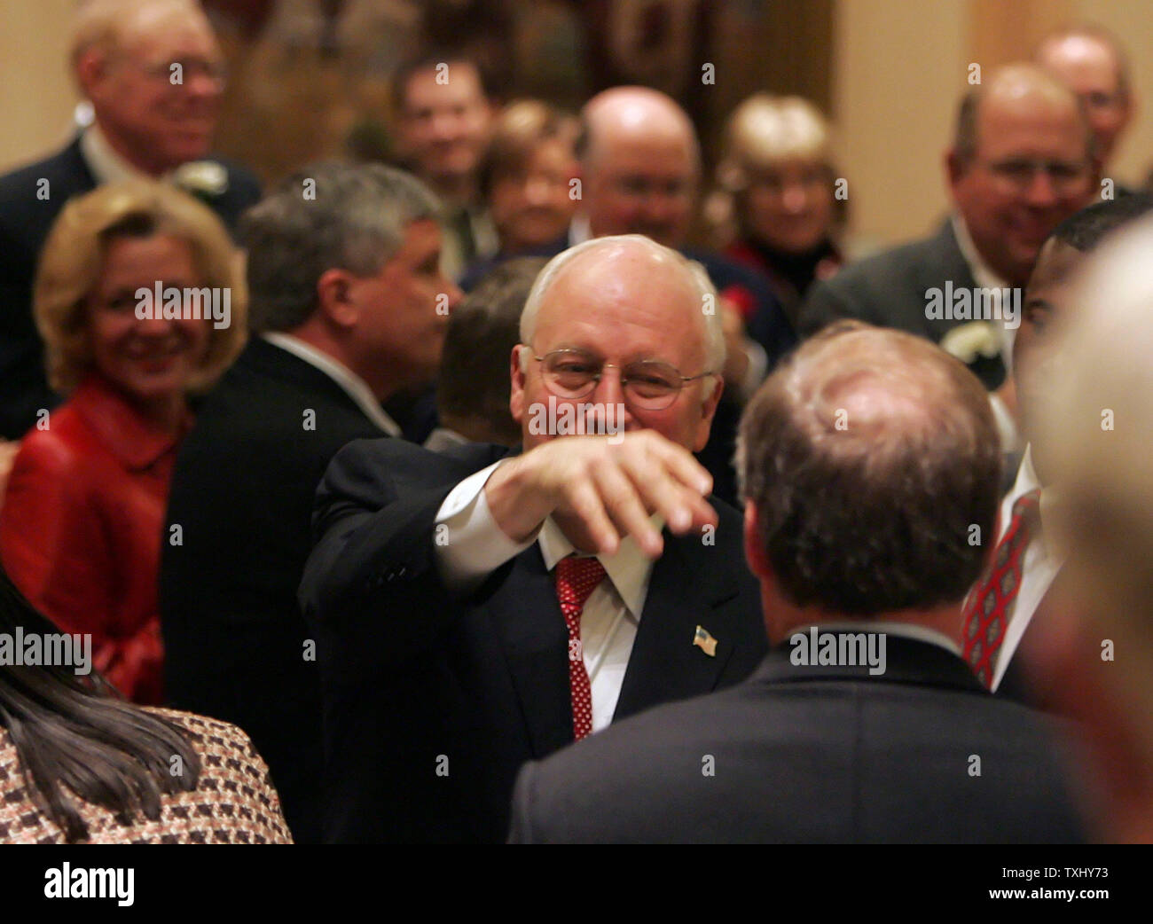 Vice President Dick Cheney (C) reaches out to shake hands after his ...