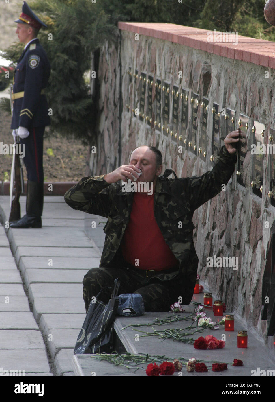 A man commemorates his fire fighter friends who died during the ...