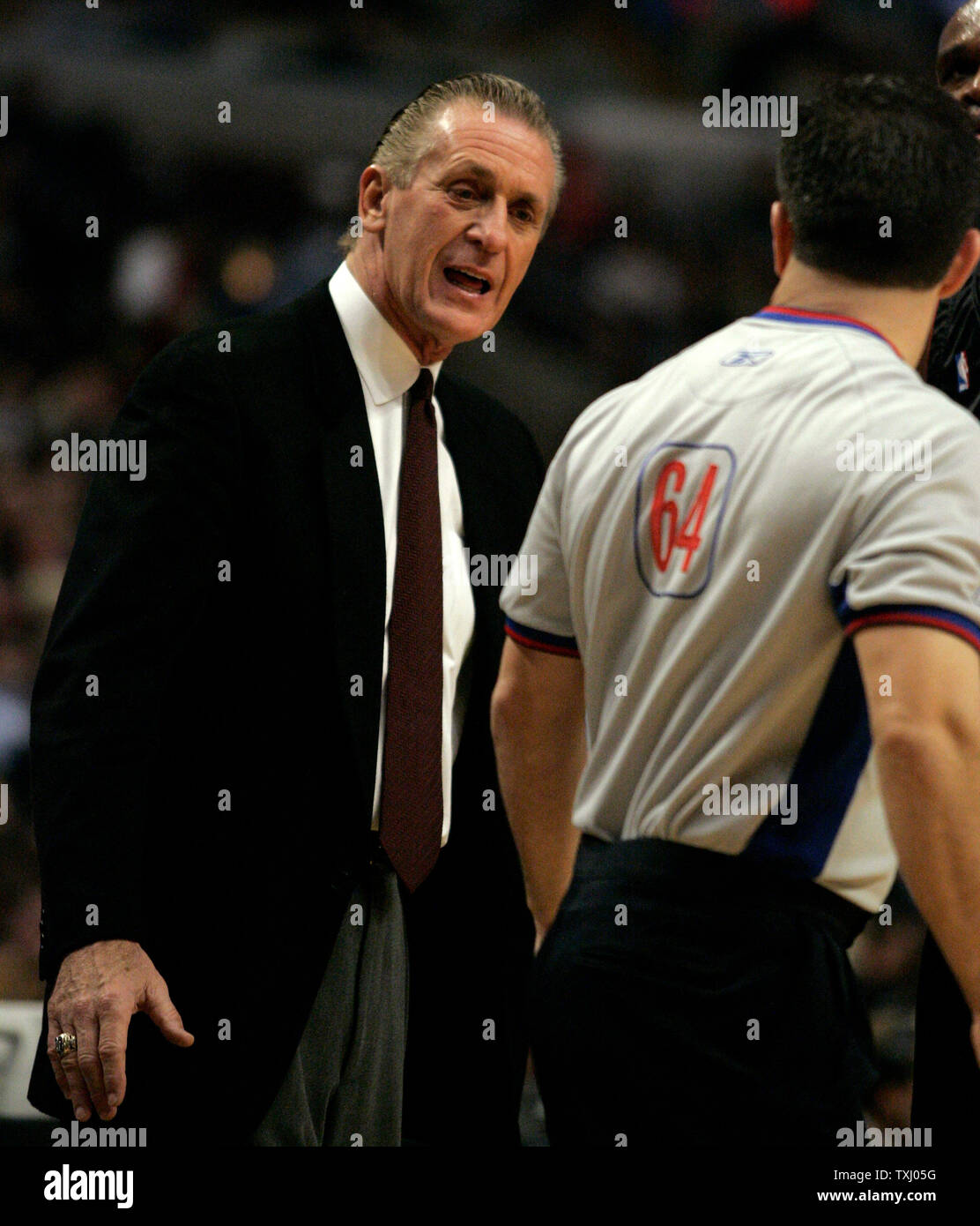 Miami Heat's interim head coach Pat Riley yells at an official during ...