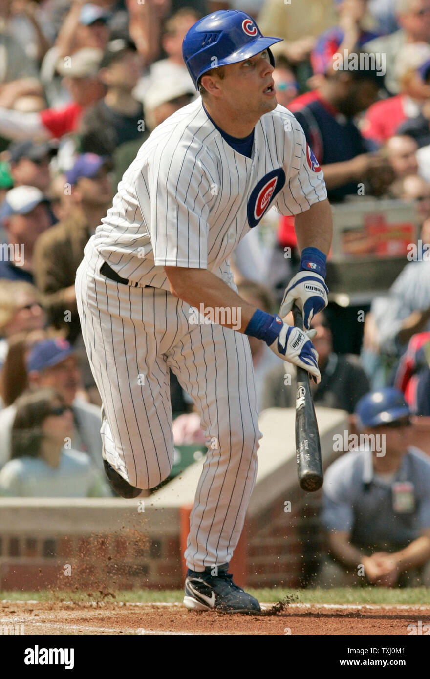 Chicago Cubs' Michael Barrett watches his sacrifice fly scoring Derrek ...