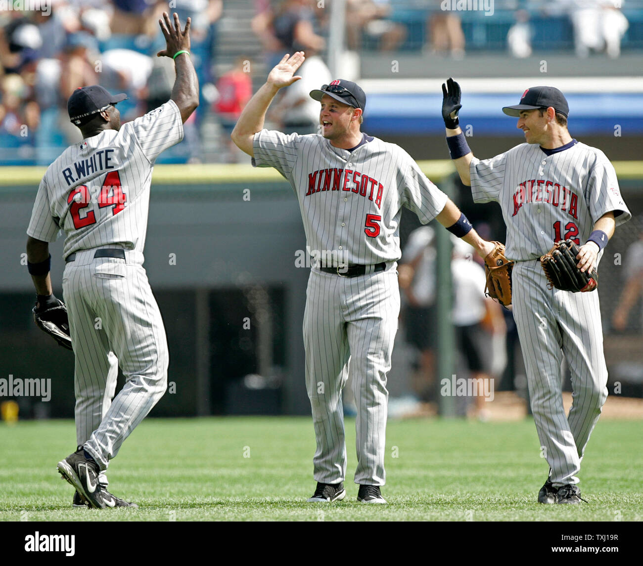 Minnesota Twins Rondell White (24), Michael Cuddyer (5) and Jason Tyner ...