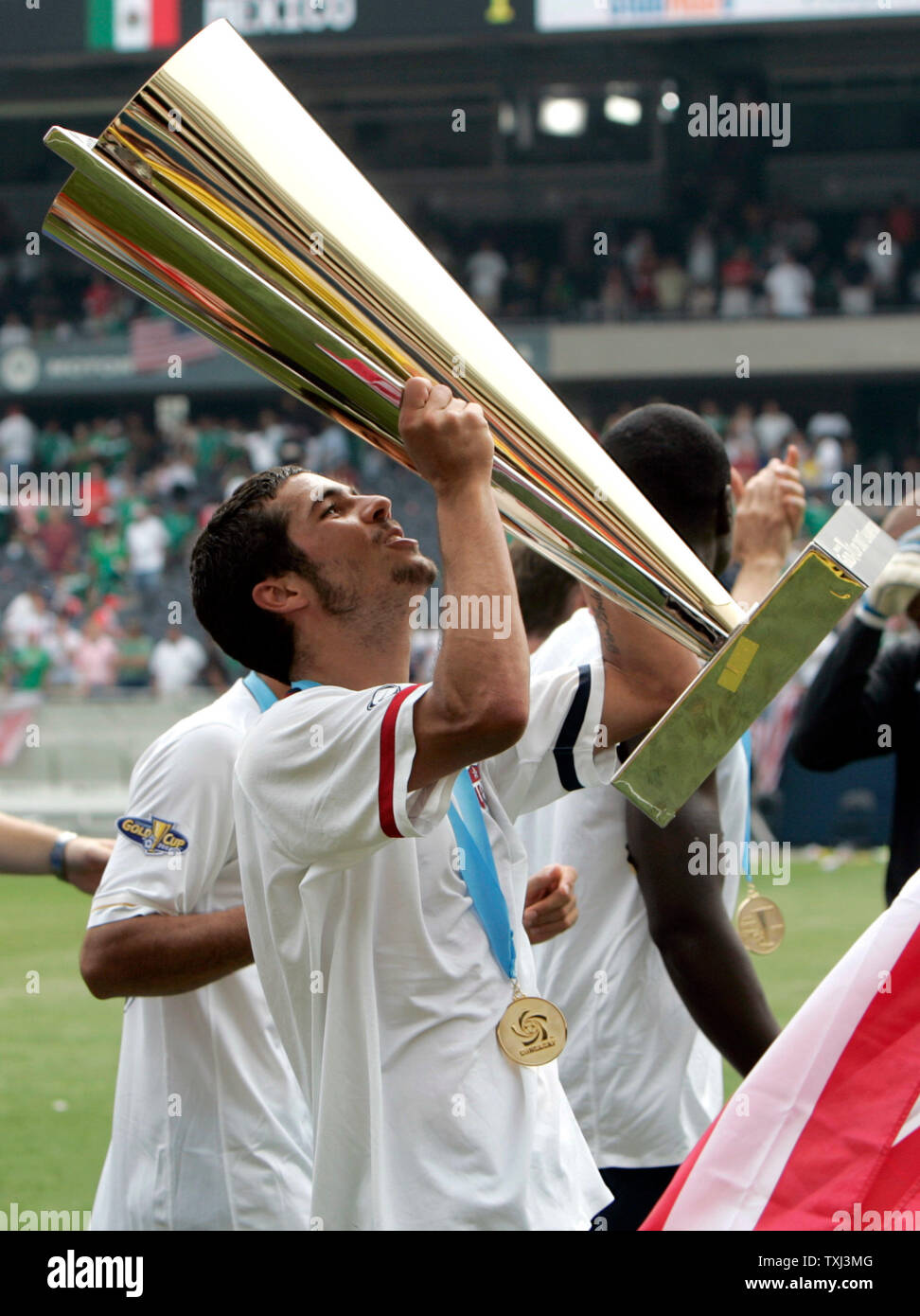 USA's Benny Feilhaber lifts the Championship trophy after defeating ...