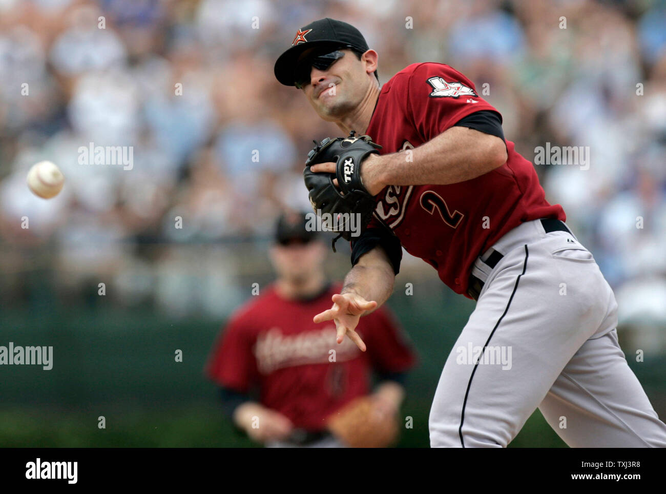 Houston Astros second baseman Chris Burke throws out Chicago Cubs base ...