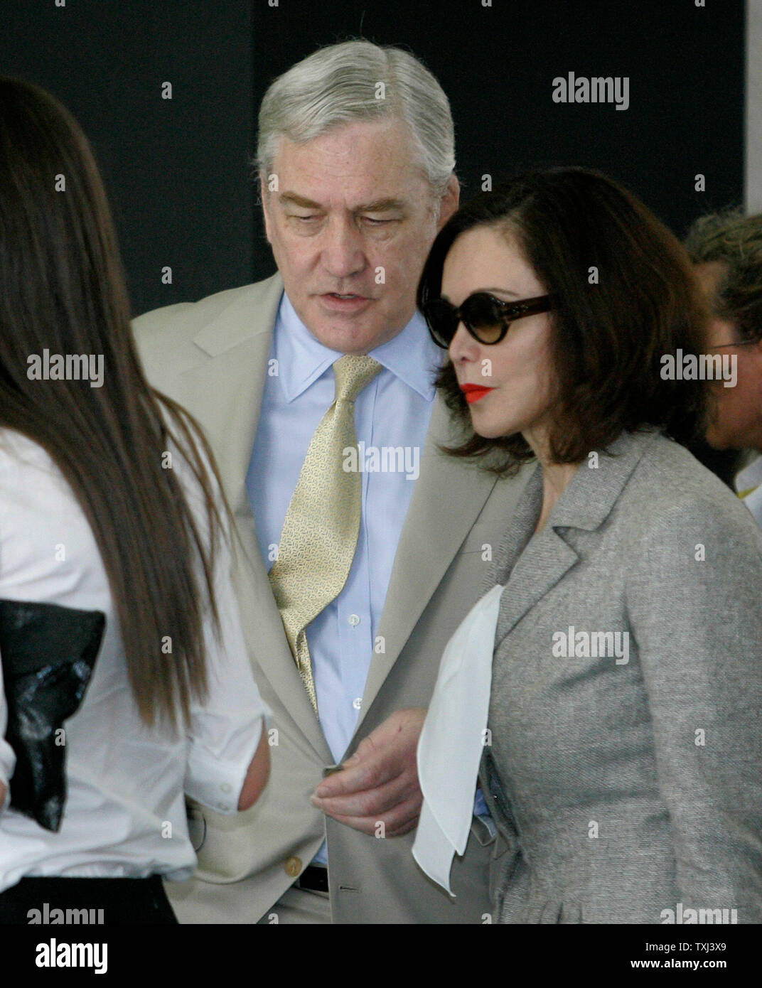Conrad Black (L) arrives with his wife Barbara Amiel for a bond hearing ...