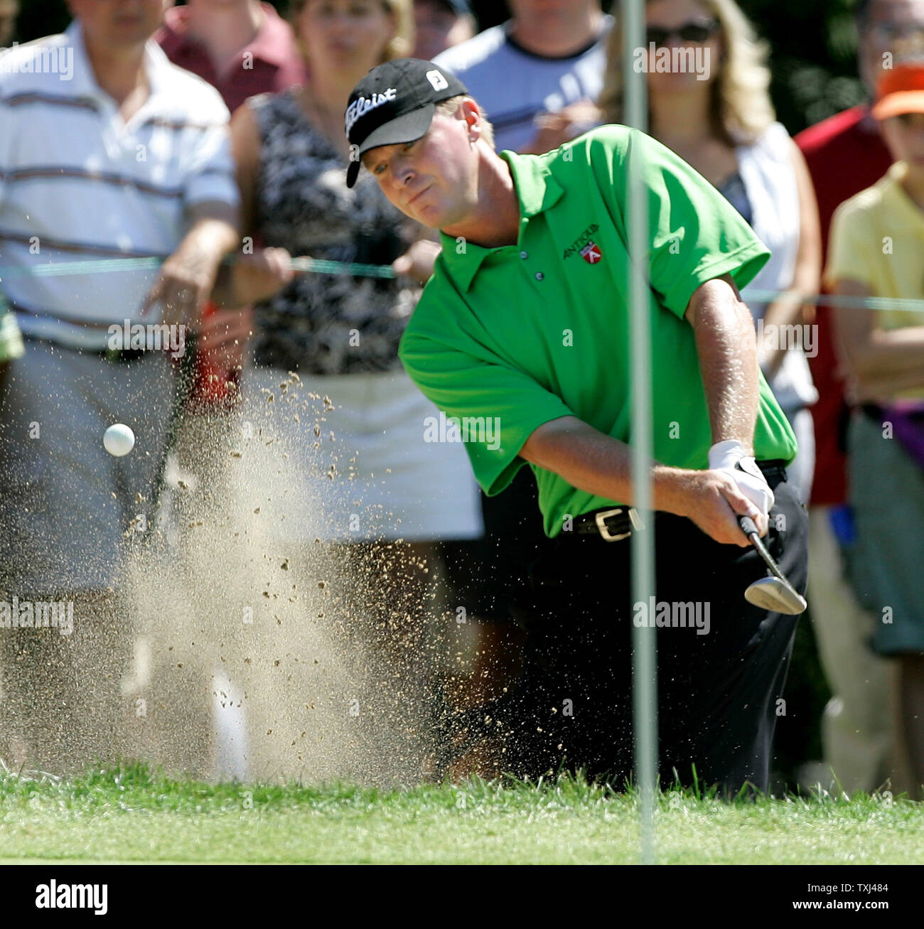 Steve Stricker chips out of a bunker onto the third green during the ...