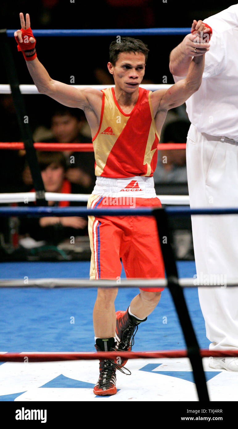 Harry Tanamor of the Philipines celebrates his 16-8 win over Amnat ...