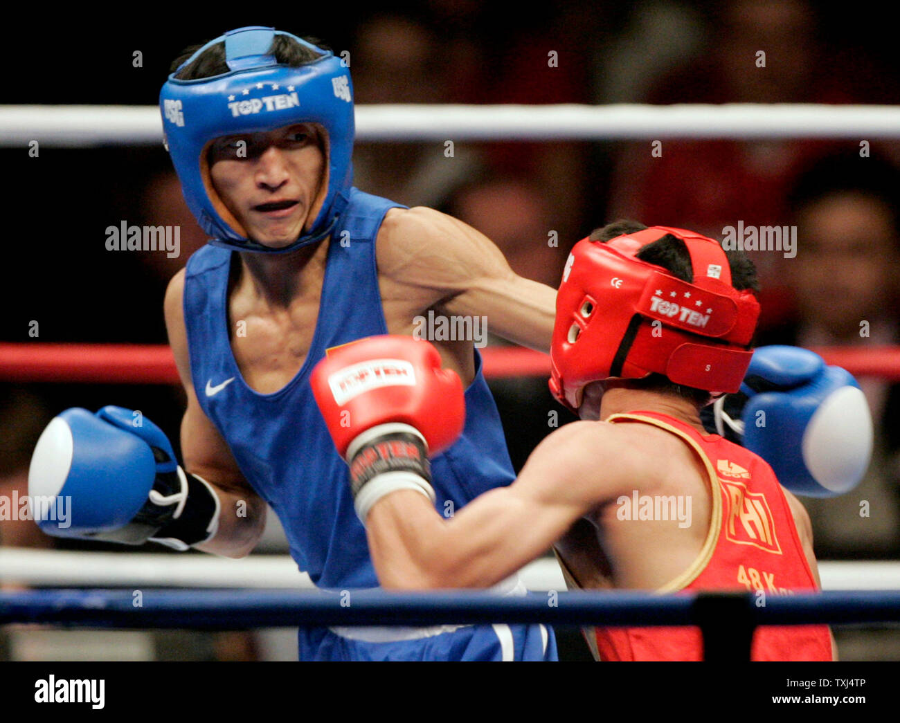 Shiming Zou of China, left, battles Harry Tanamor of the Philippines ...