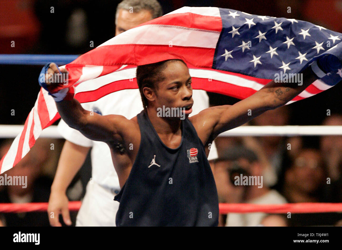 Raushee Warren of the USA celebrates his 13-9 victory over Somjit ...