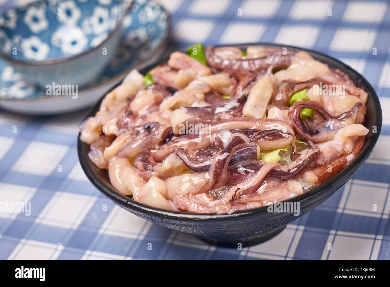 Squid whiskers with a hot pot side dish kept fresh with ice Stock Photo ...
