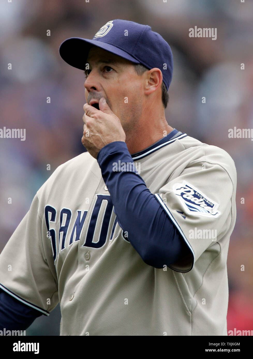 San Diego Padres starting pitcher Greg Maddux reacts to giving up four ...