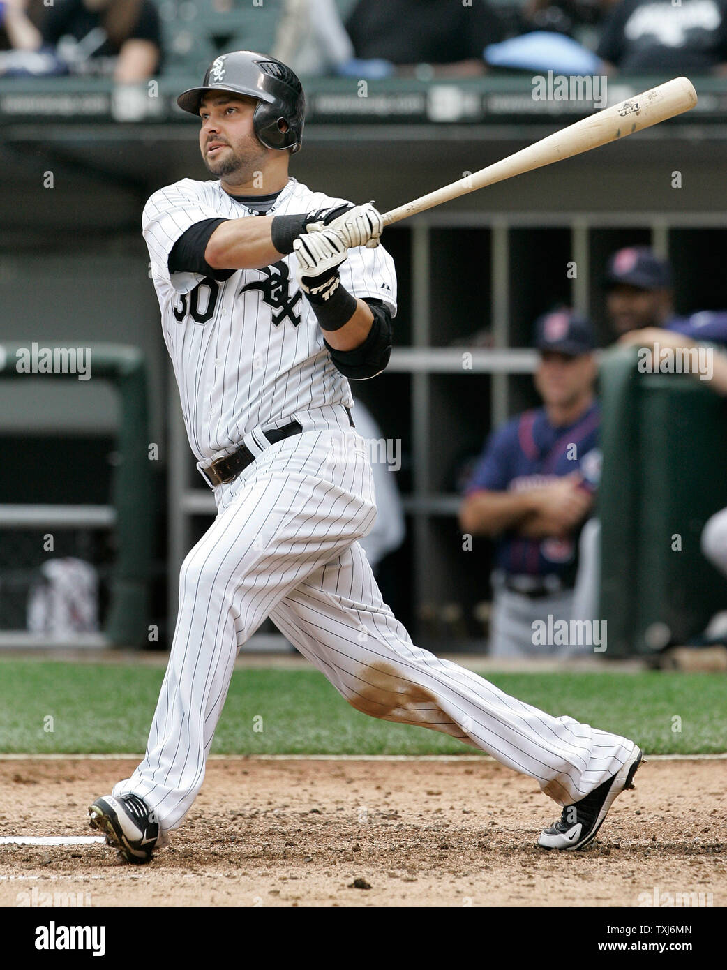 Chicago White Sox's Nick Swisher follows through on a solo homer during ...