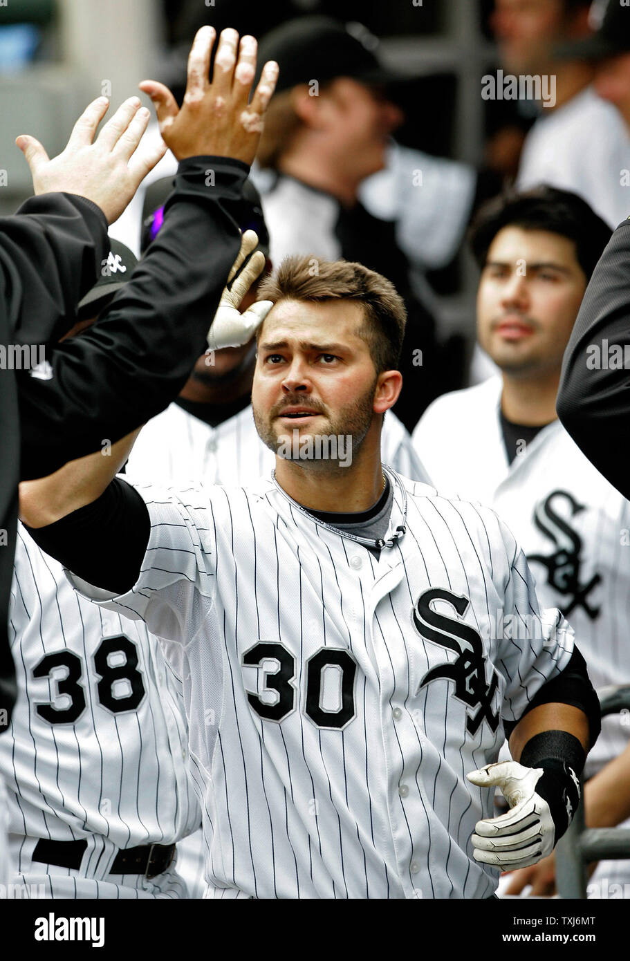 Chicago White Sox's Nick Swisher is congratulated by his teammates ...