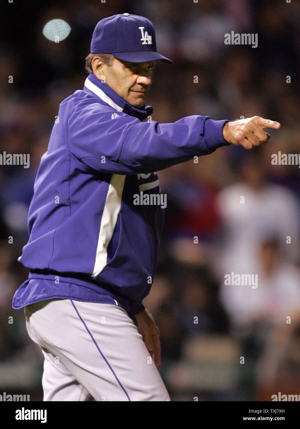 Los Angeles Dodgers manager Joe Torre calls to the bullpen for relief ...