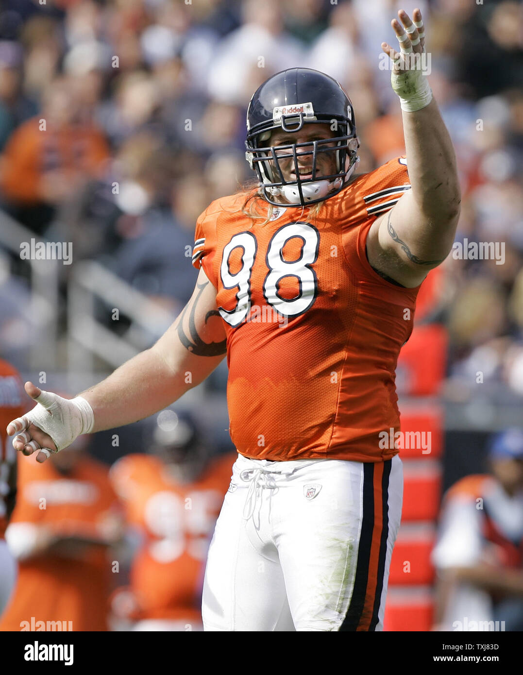 Chicago Bears defensive tackle Dusty Dvoracek pumps up the crowd during ...